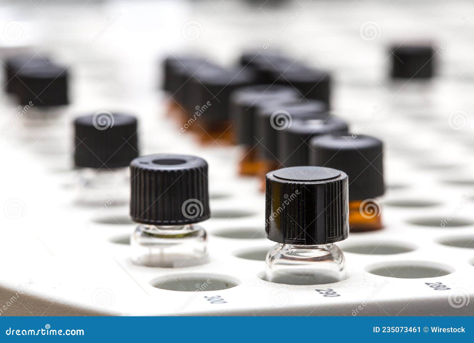 Small Bottles that Must Be Analyzed with a Laboratory Instrument Stock ...