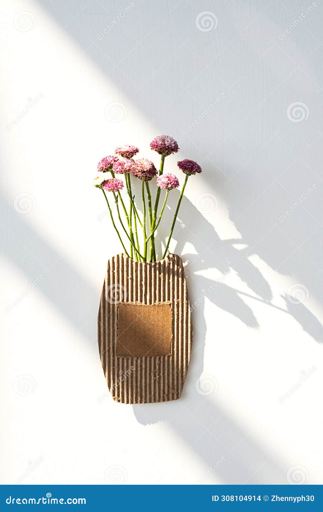 Small Bouquet of Flowers in Cardboard Vase Stock Photo - Image of ...