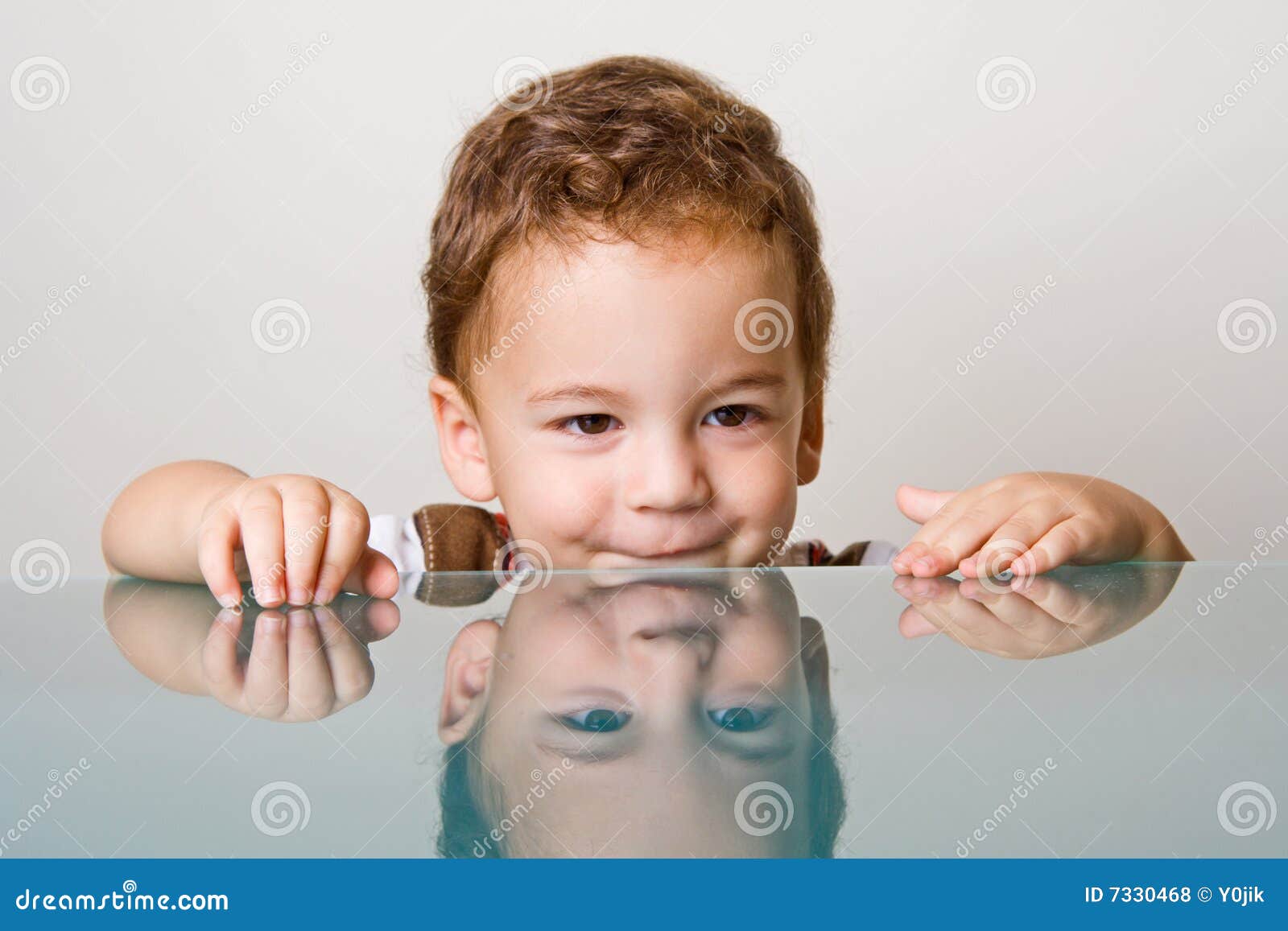 Small Boy Behind Glass Table Stock Photo - Image of childhood ...