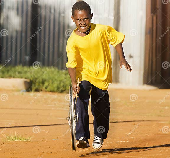 Small Boy Boy Playing with Wheel Stock Image - Image of dark ...