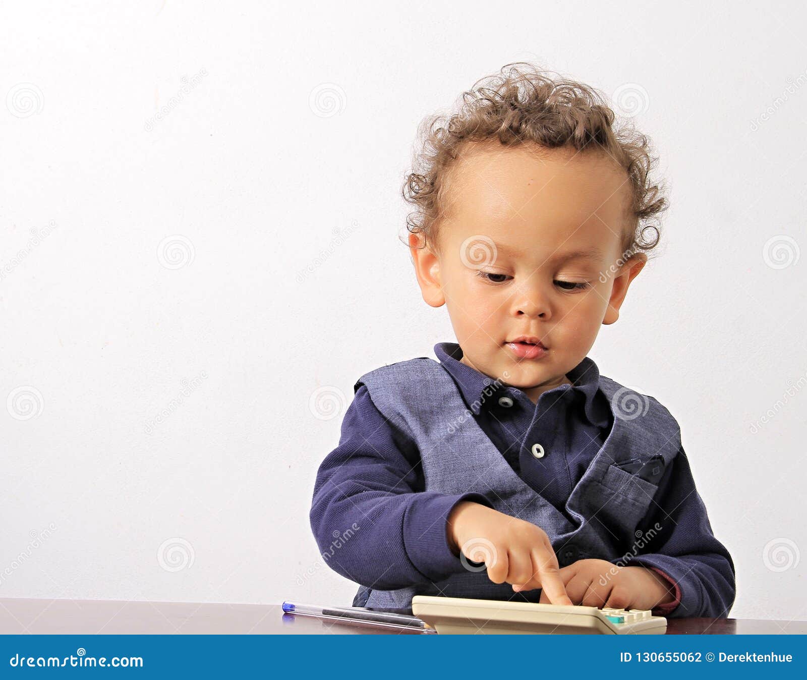 Small boy with calculators stock photo. Image of little - 130655062
