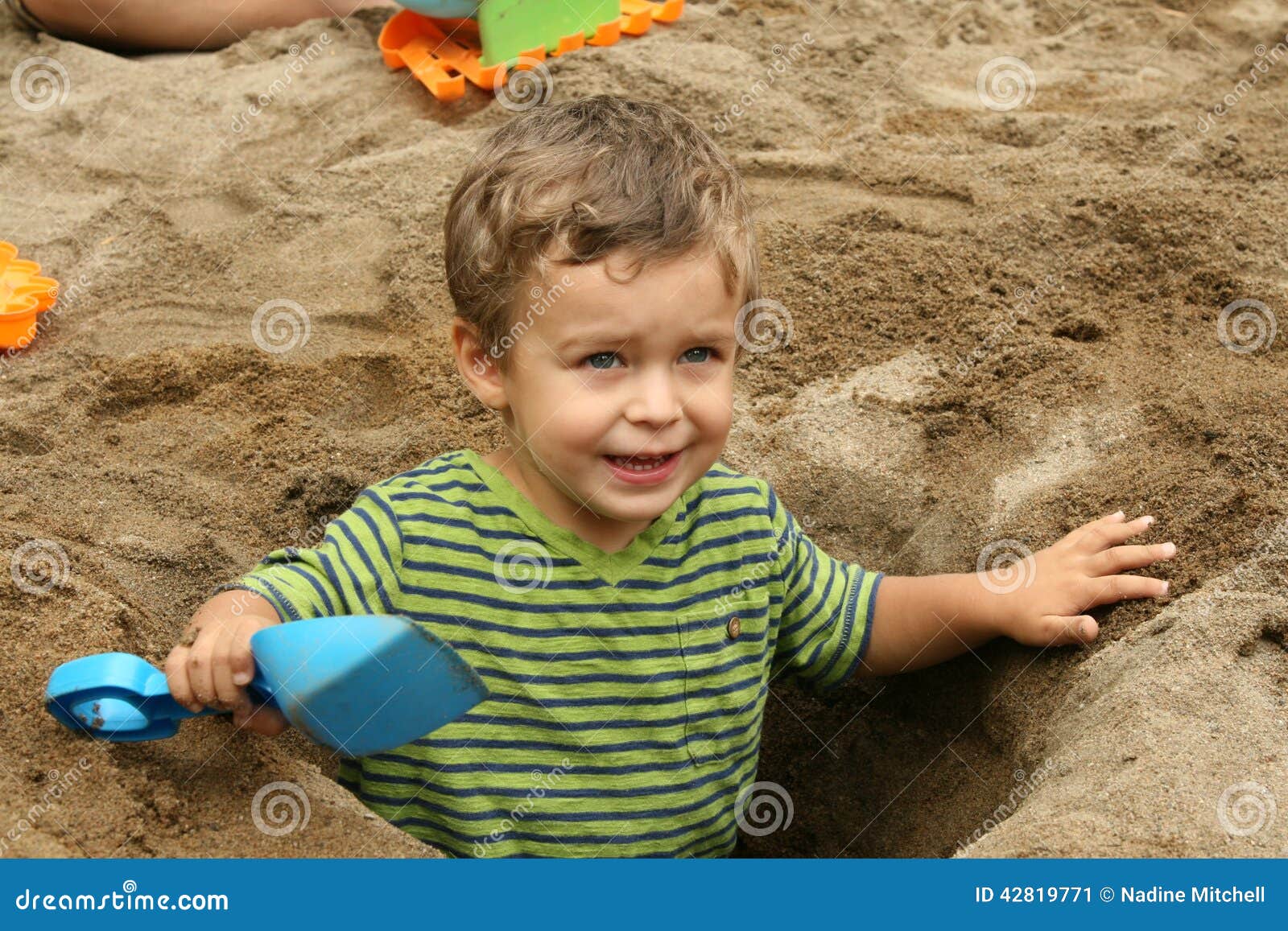 Small Boy in a Dug Out Sand Hole Stock Image - Image of digging ...