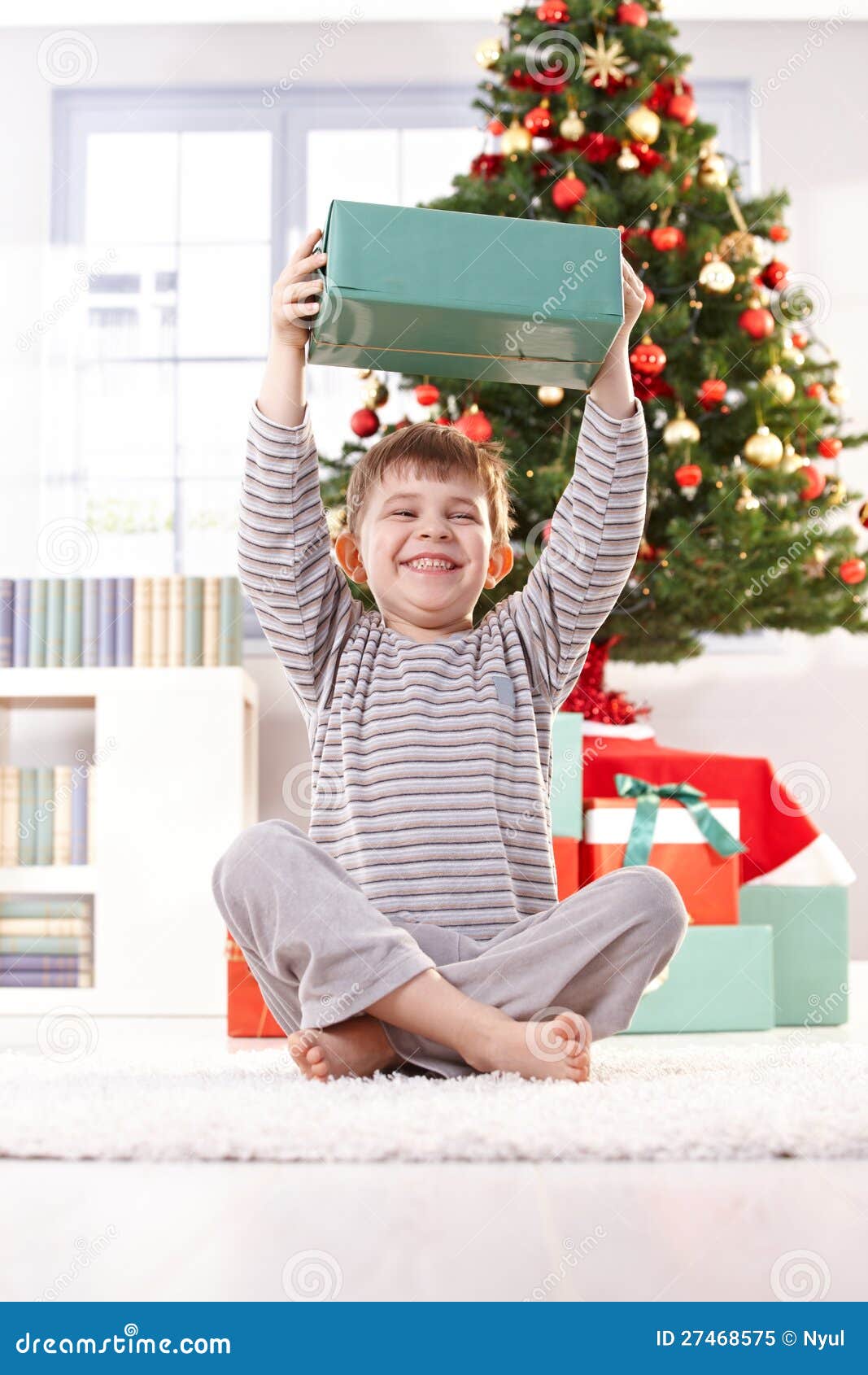 Small Boy Laughing with Christmas Present Stock Image - Image of ...