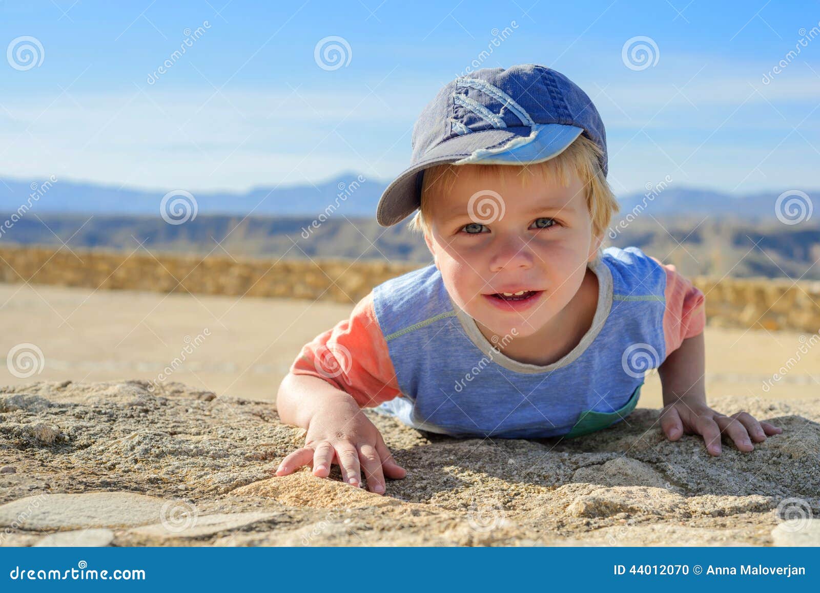 Small Boy Laying Down on the Rock Stock Photo - Image of spring, small ...