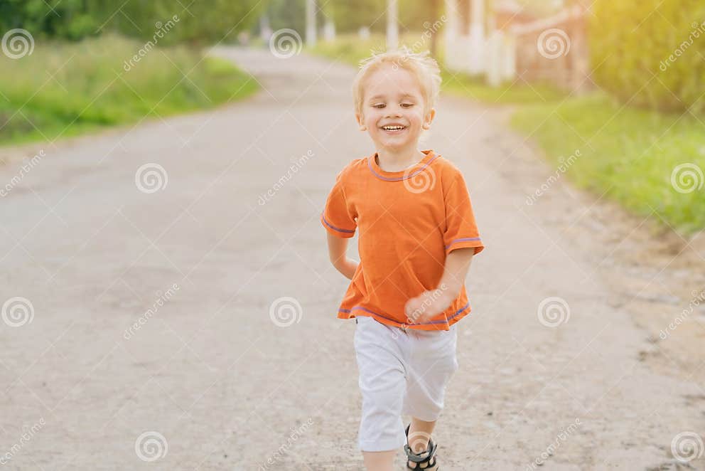 Small Boy Running Forward. he is Happy and Funny Stock Photo - Image of ...