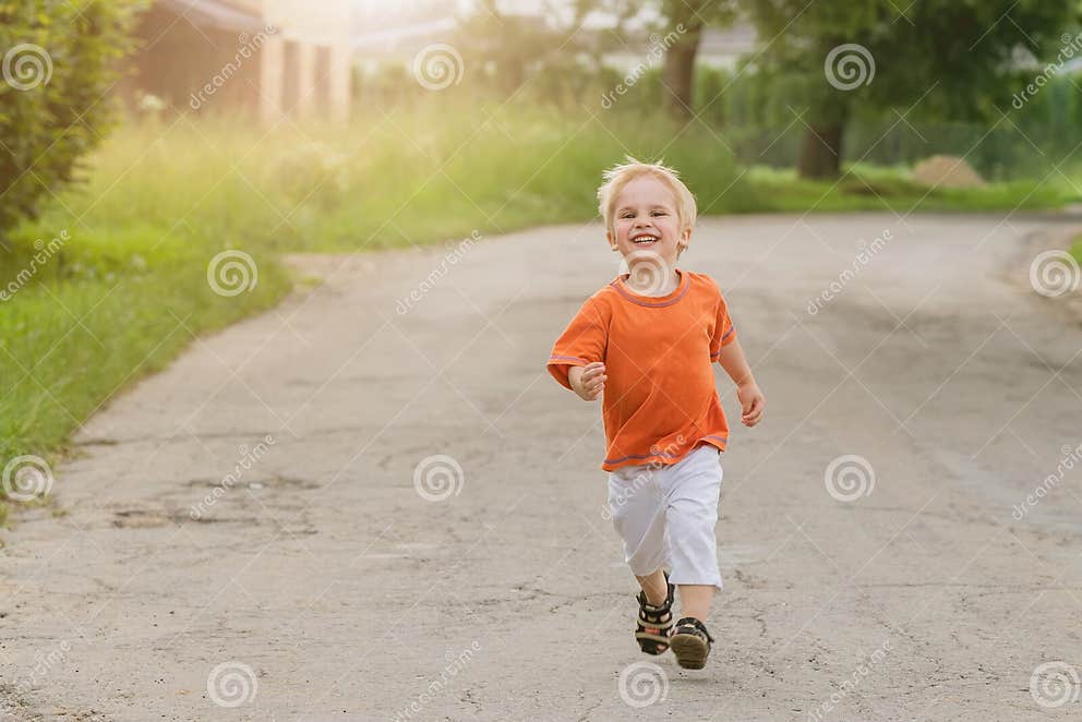 Small Boy Running Forward. he is Happy and Funny Stock Photo - Image of ...
