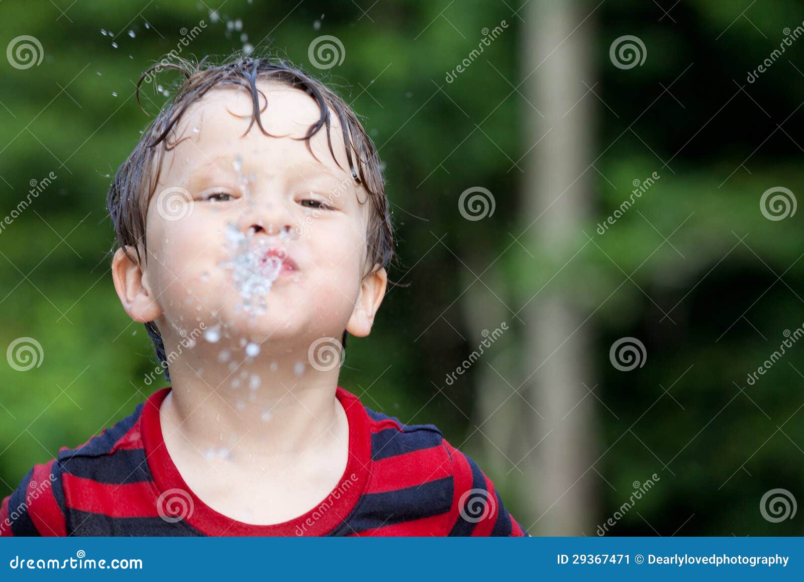 A small boy spits water stock image. Image of child, young - 29367471