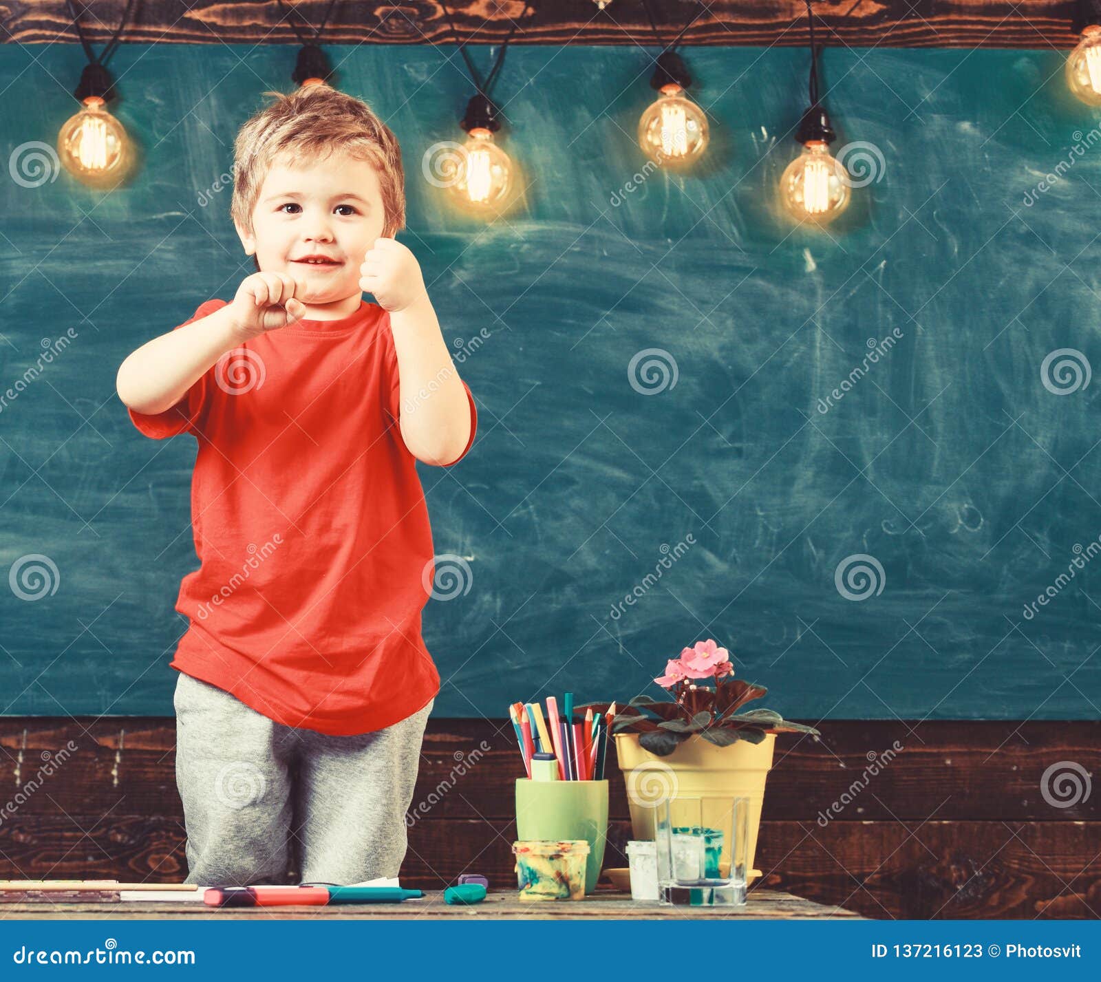 Small Boy Standing Behind the Table. Cute Kid Boxing in the Classroom ...
