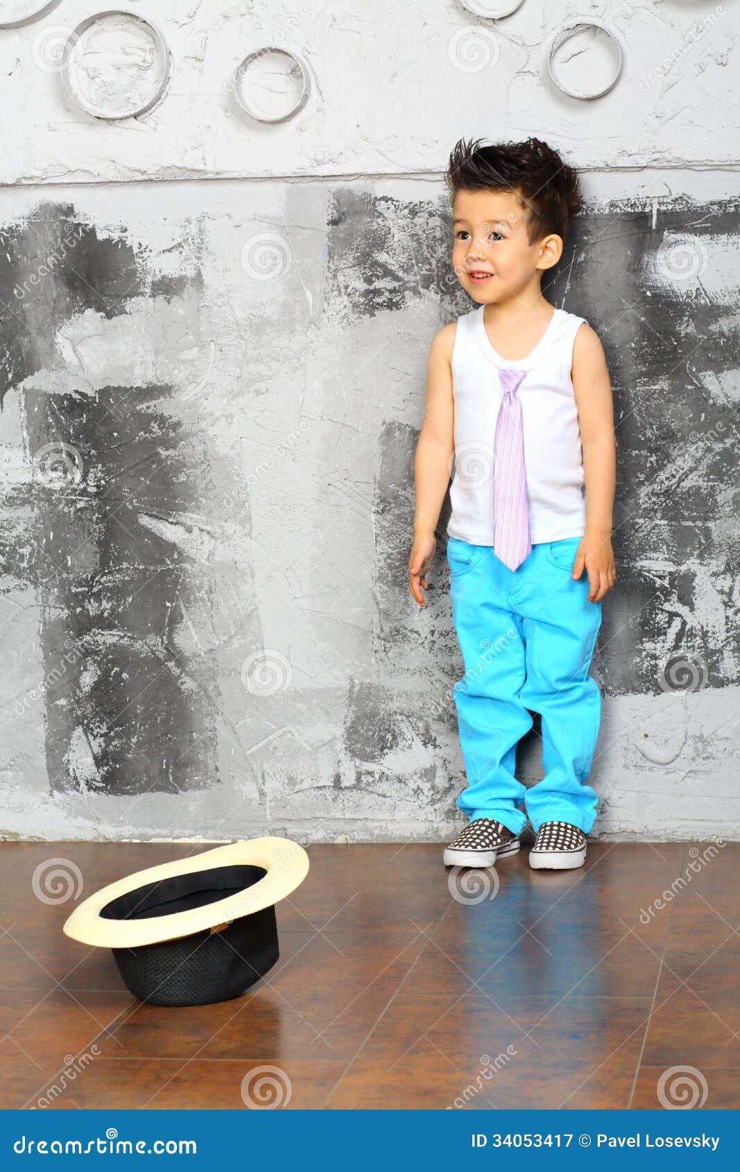 Small Boy Stands Near the Gray Wall Stock Image - Image of smile, black ...