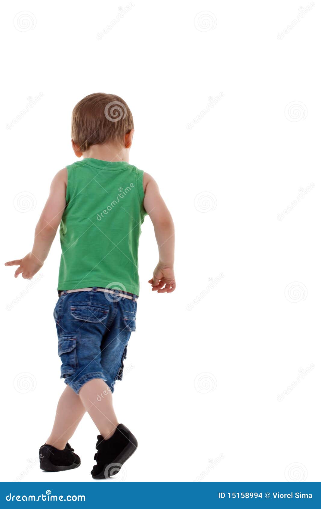 Small boy walking stock photo. Image of brunette, child - 15158994