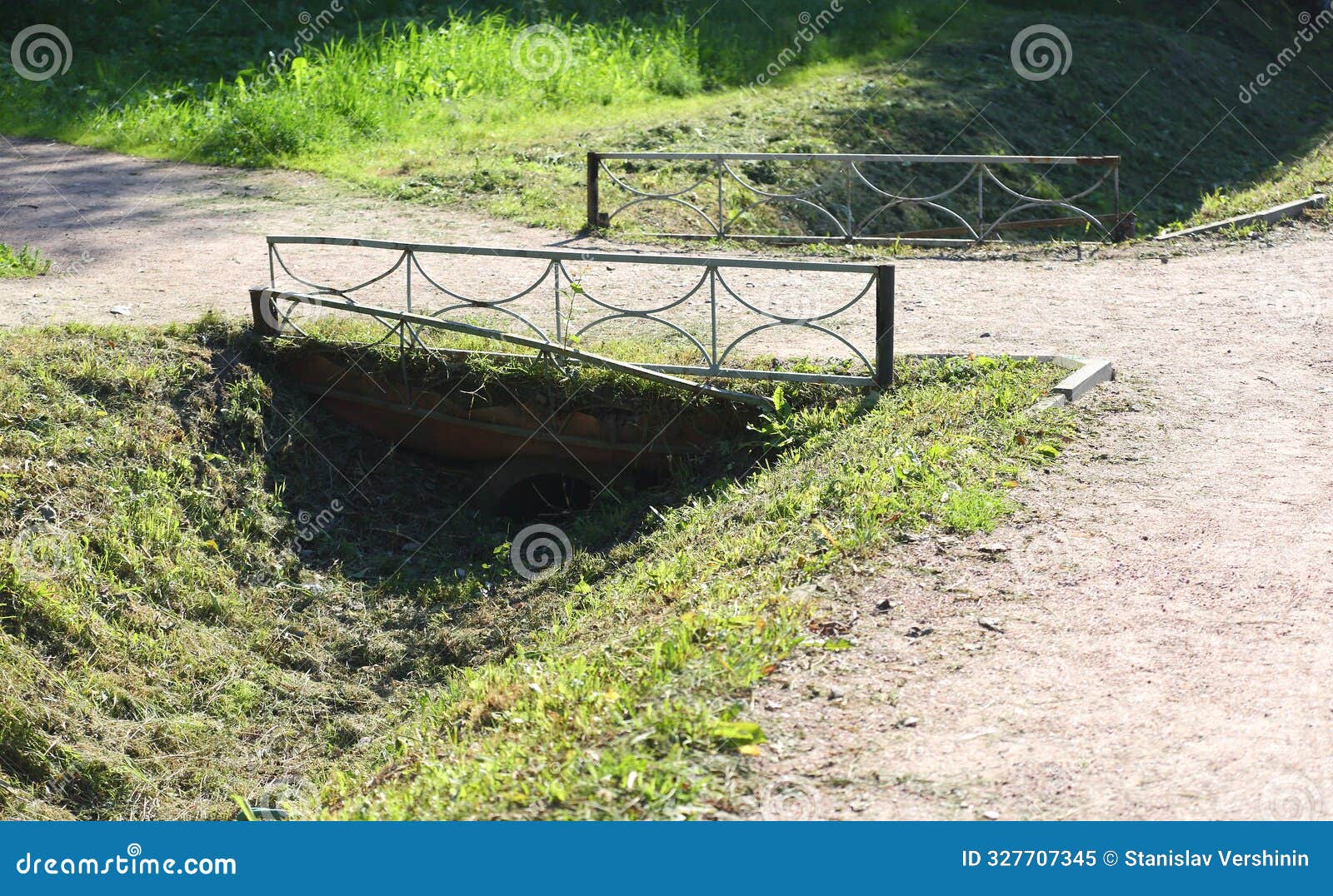 Small Bridge Over a Drainage Ditch in the Park Stock Image - Image of ...