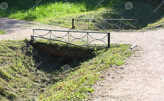 Small Bridge Over a Drainage Ditch in the Park Stock Image - Image of ...