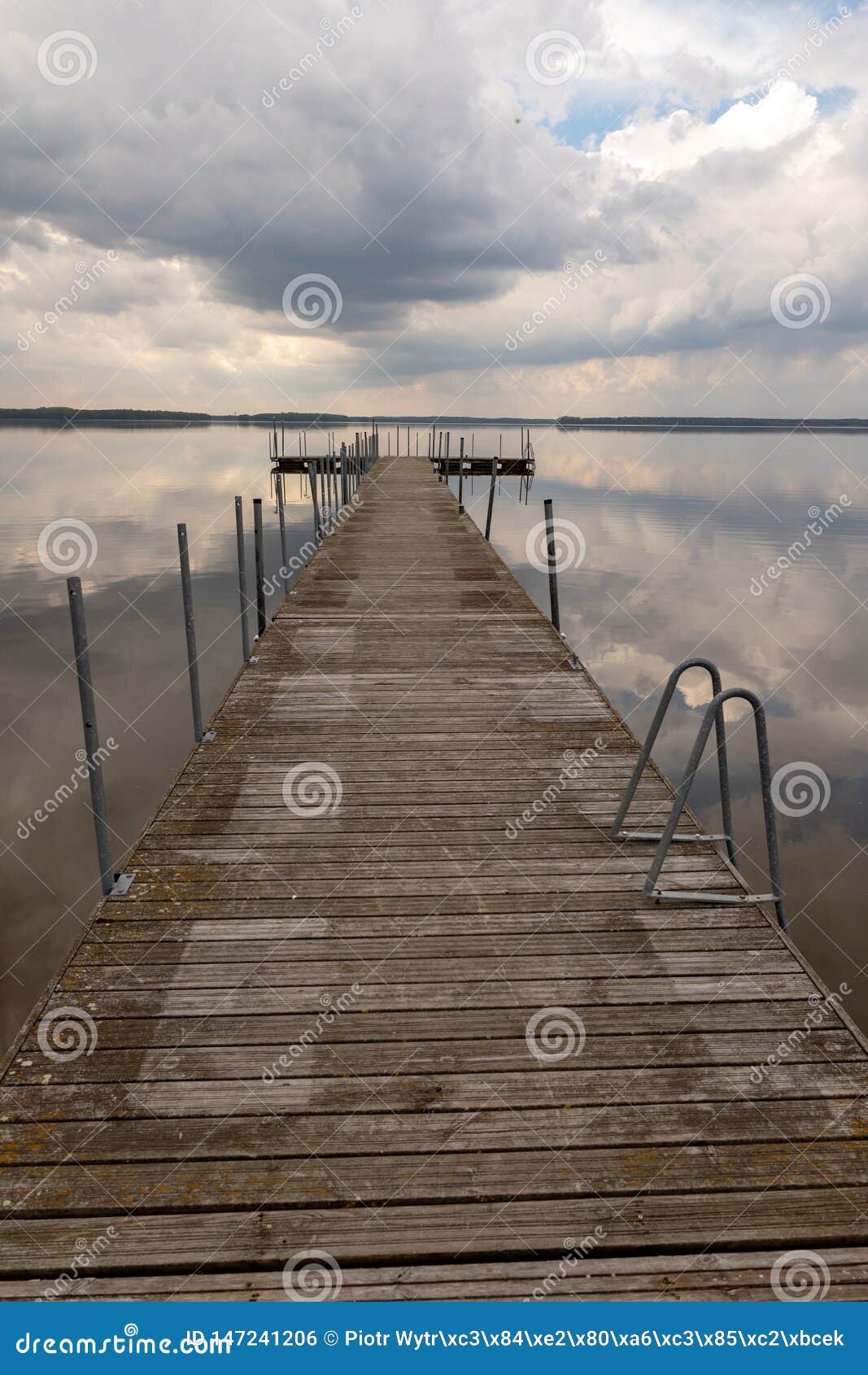 A Small Bridge Over the Lake. Reflection of Clouds on the Lake S ...