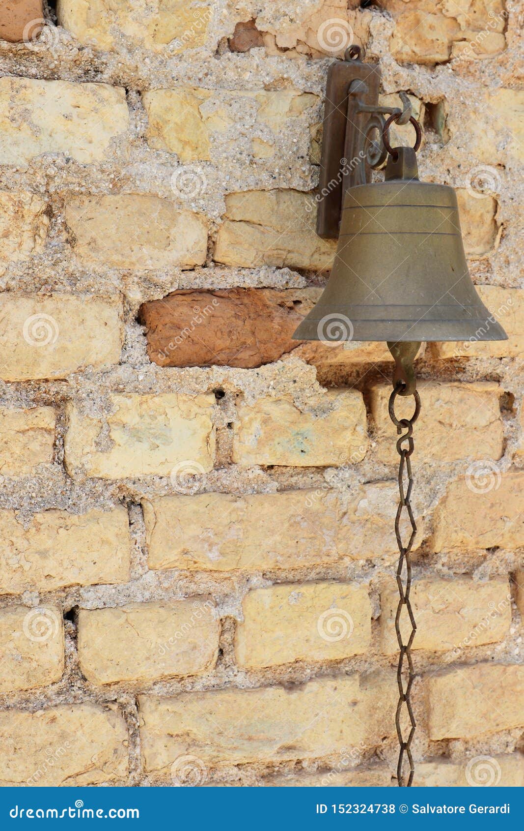 Small Bronze Bell Fixed To a Bricks Wall Stock Photo - Image of small ...