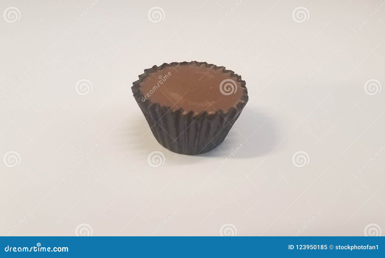 Small Brown Chocolate Candy in Wrapper on White Surface Stock Image ...