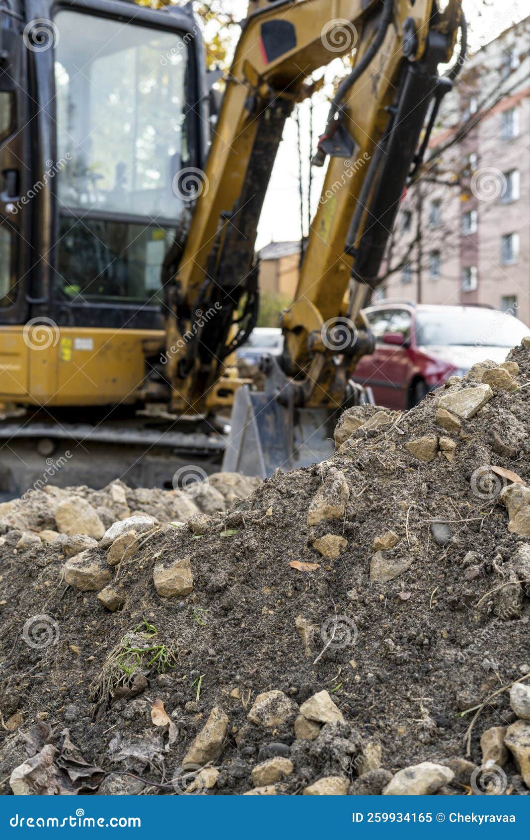 Small Bulldozer at Work. Orange Excavator on the Road Stock Image ...