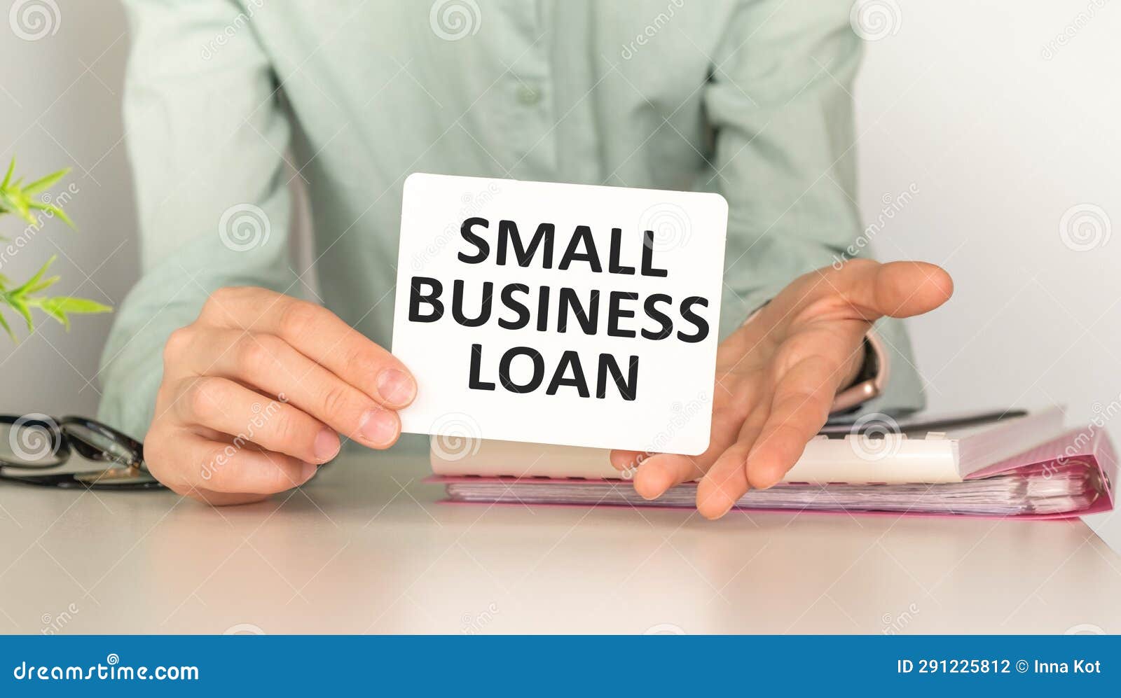 SMALL BUSINESS LOAN Text on Paper with Chart and Office Tools ...