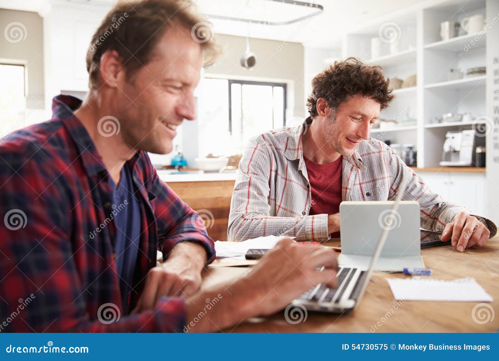 Small Business Partners Using Computers at Home Stock Image - Image of ...