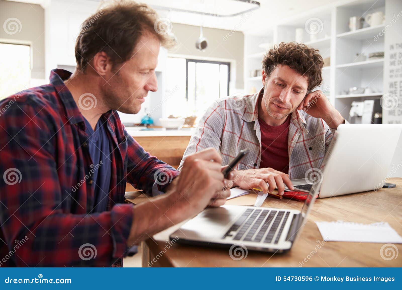 Small Business Partners Using Computers at Home Stock Photo - Image of ...