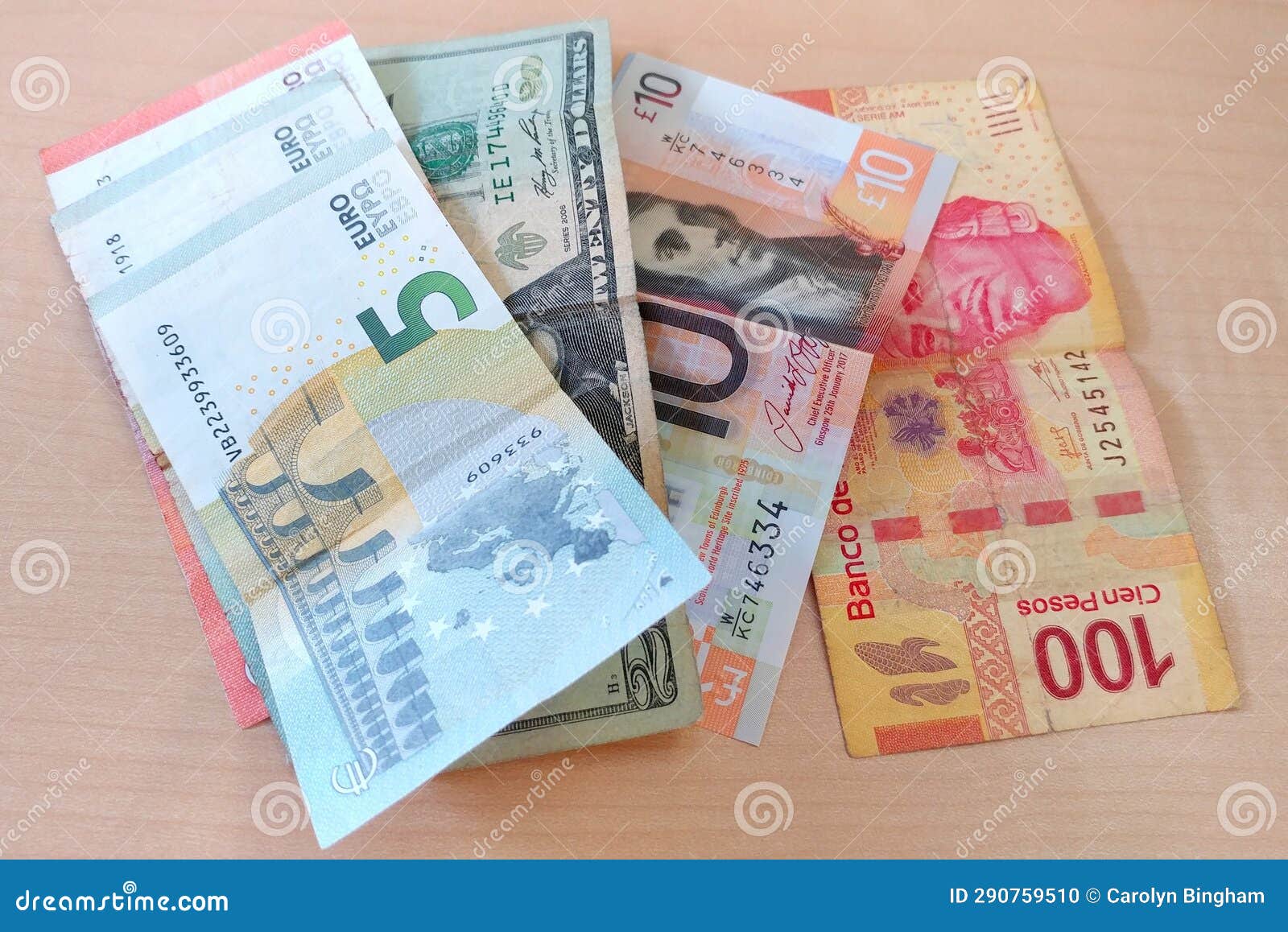 A Small Cache of Currency stock photo. Image of writing - 290759510