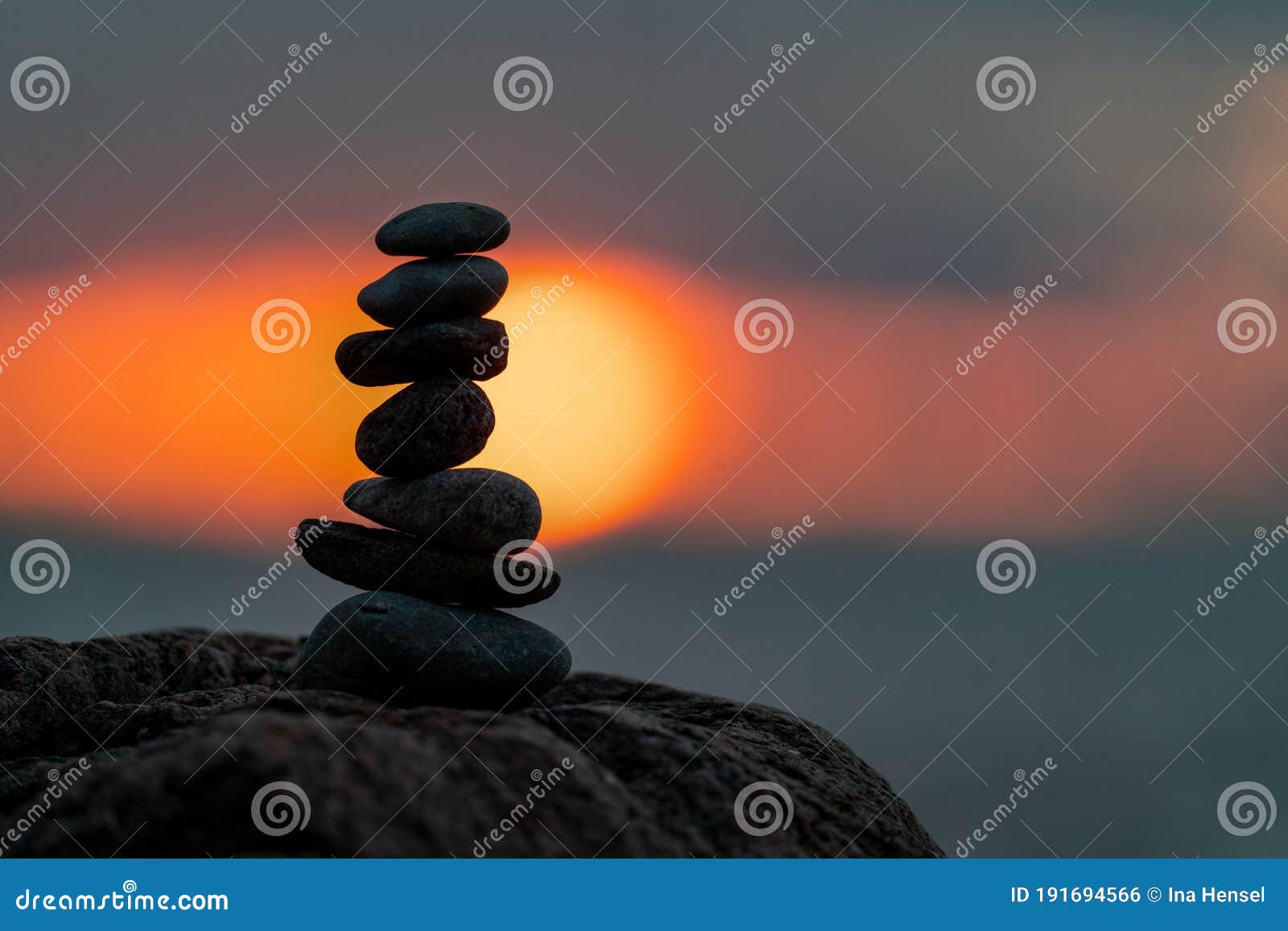 A Small Cairn Placed on a Rock at Sunset Stock Photo - Image of ocean ...