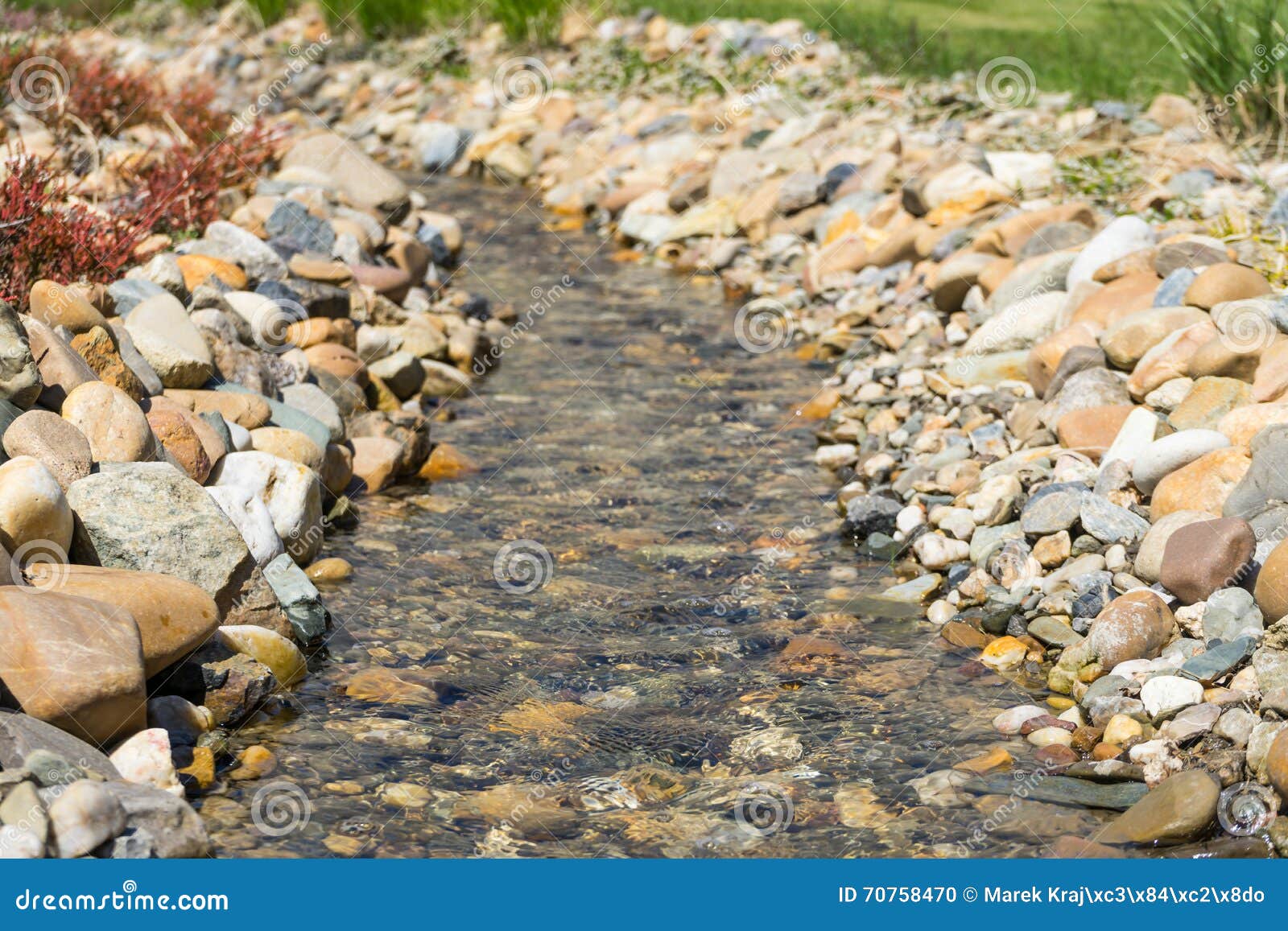 Small Calm Stream. Stream Surrounded by Rocks. Soft Focus Stock Photo ...