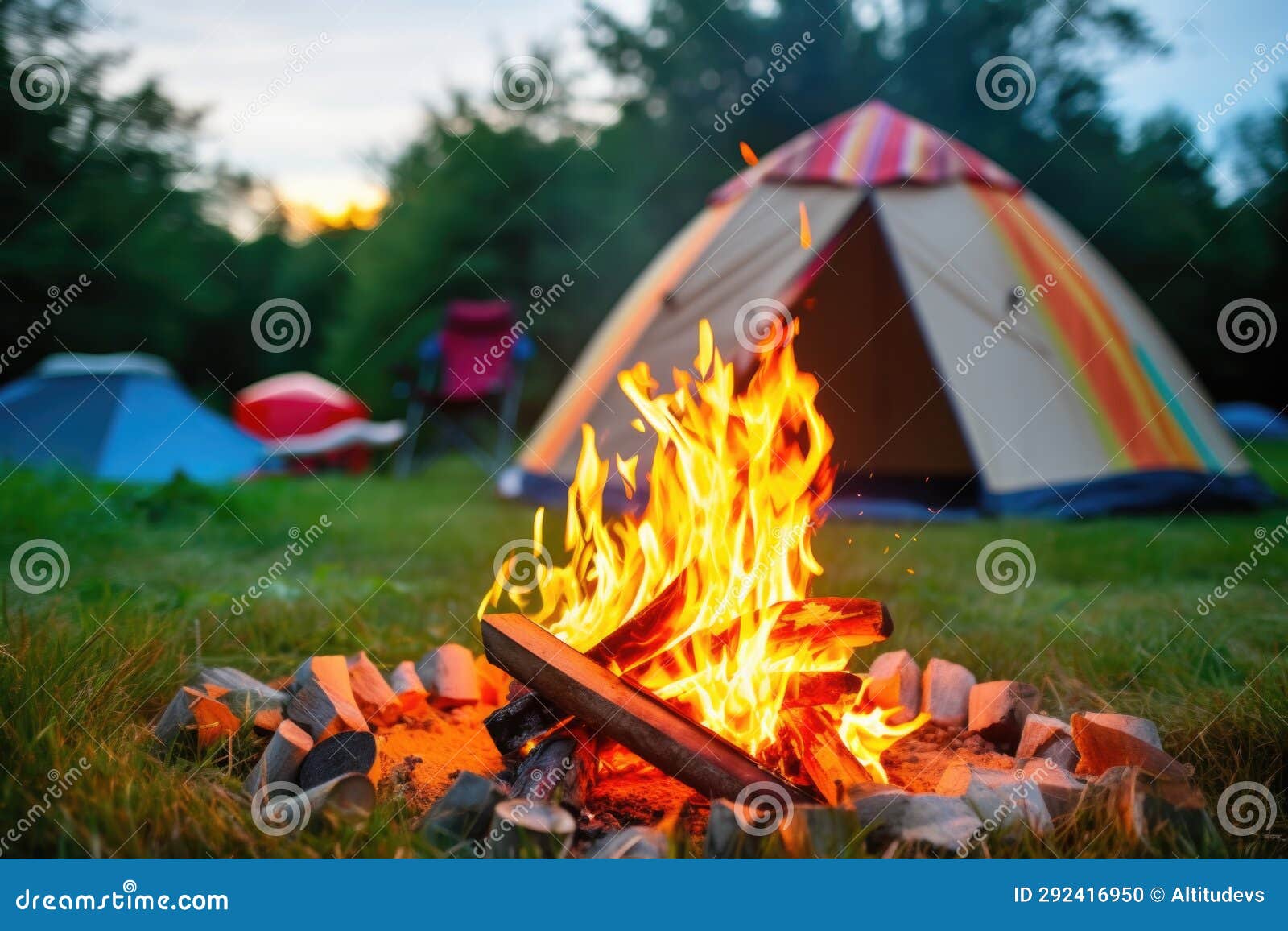 Small Campfire Burning in Front of a Colorful Tent Stock Photo - Image ...