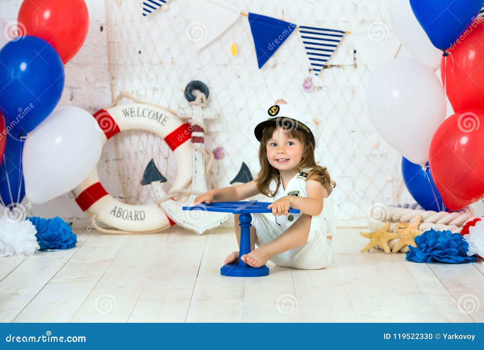 The Small Captain Sits on the Floor in a Marine Style. we Mark the ...