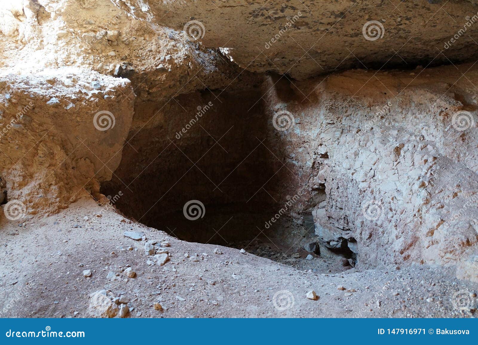 Small cave in the desert stock image. Image of cave - 147916971