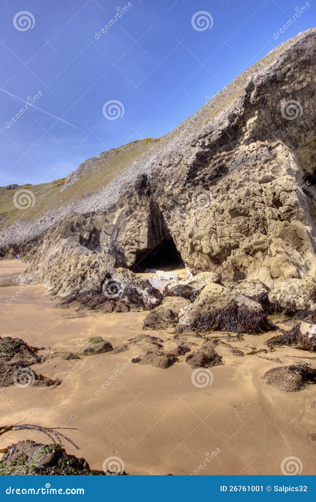 A small cave on a beach stock image. Image of beach, golden - 26761001