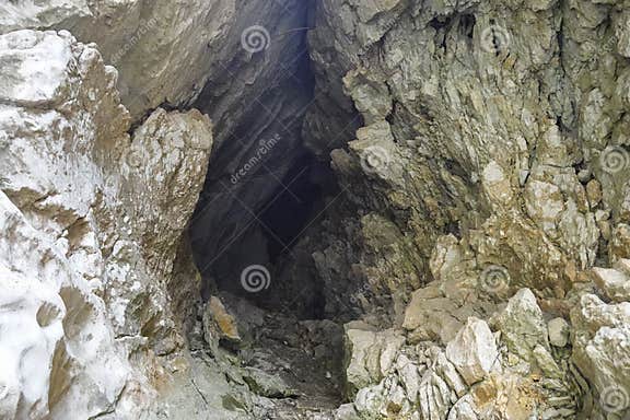 A Small Cave with a Hole in the Middle Stock Photo - Image of nature ...