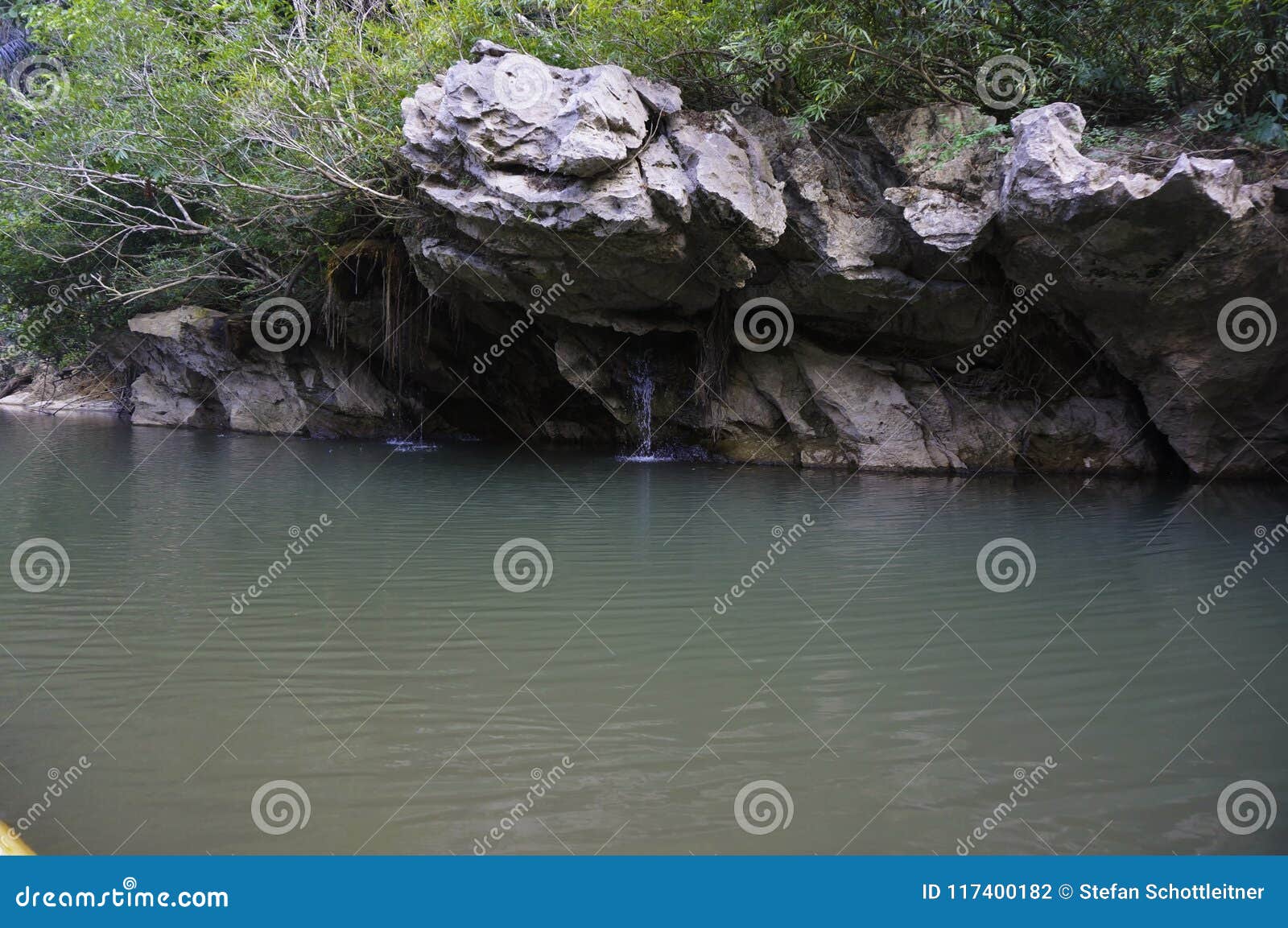 A small cave at the river stock photo. Image of autumn - 117400182