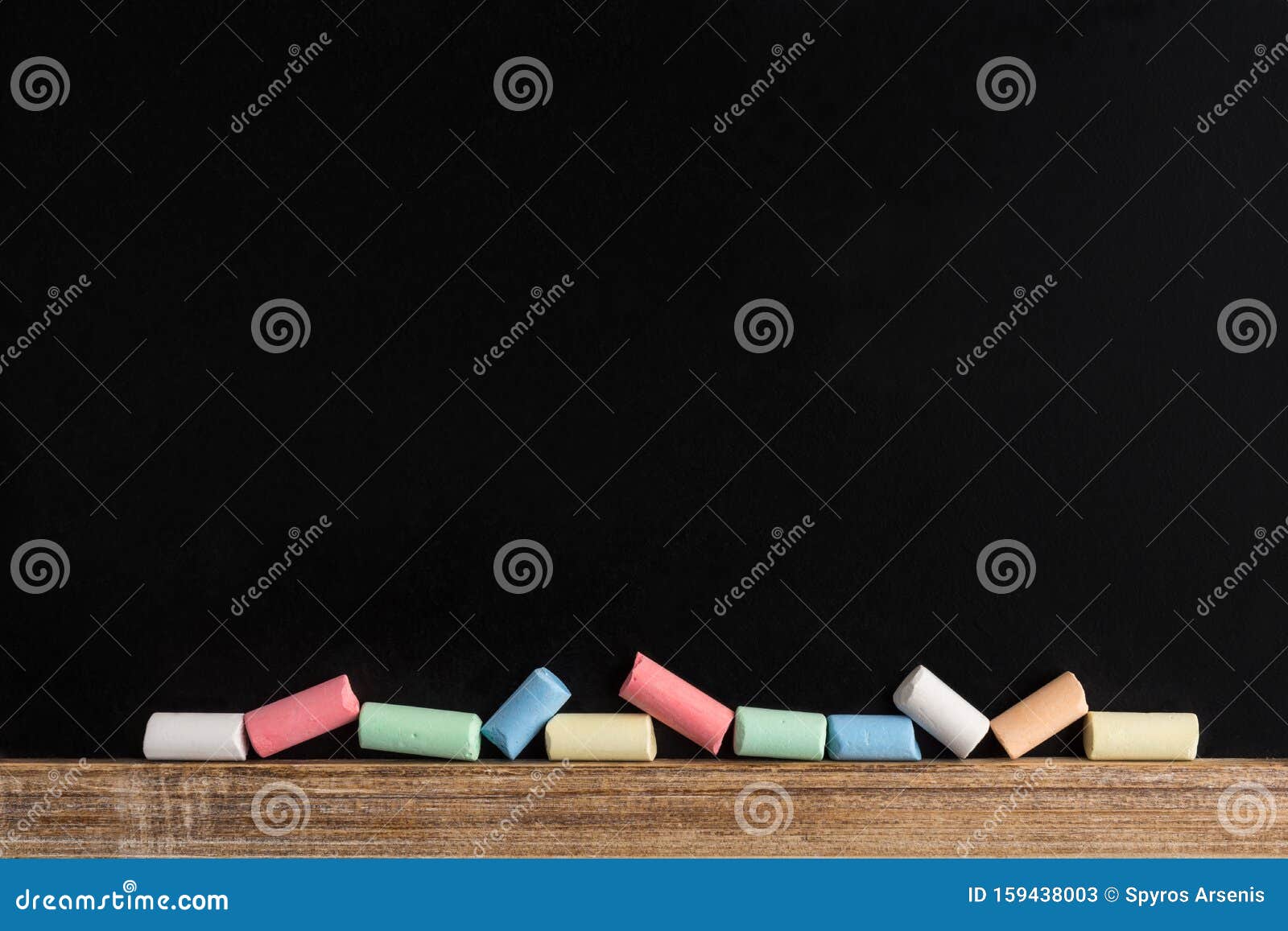 Small Chalk Pieces in Different Colors on a Blackboard Stock Image ...