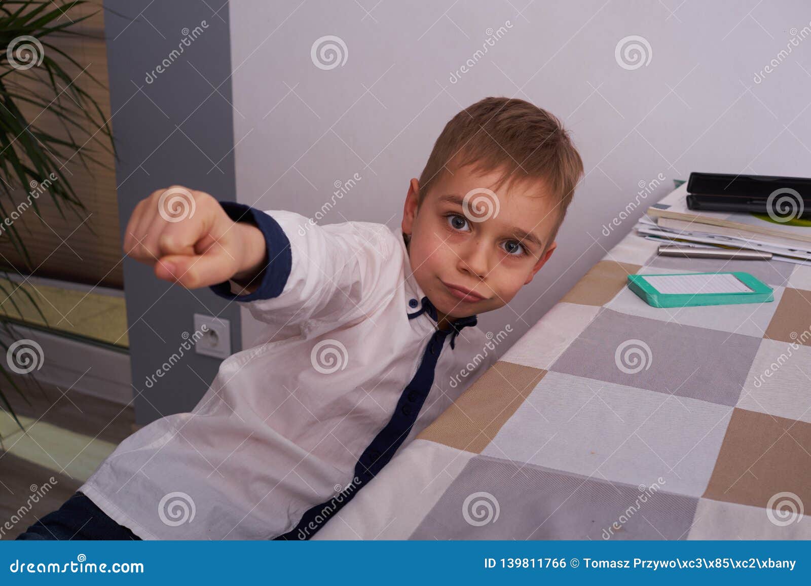 A Small Cheerful Boy Has a Plan Stock Photo - Image of shows, upset ...