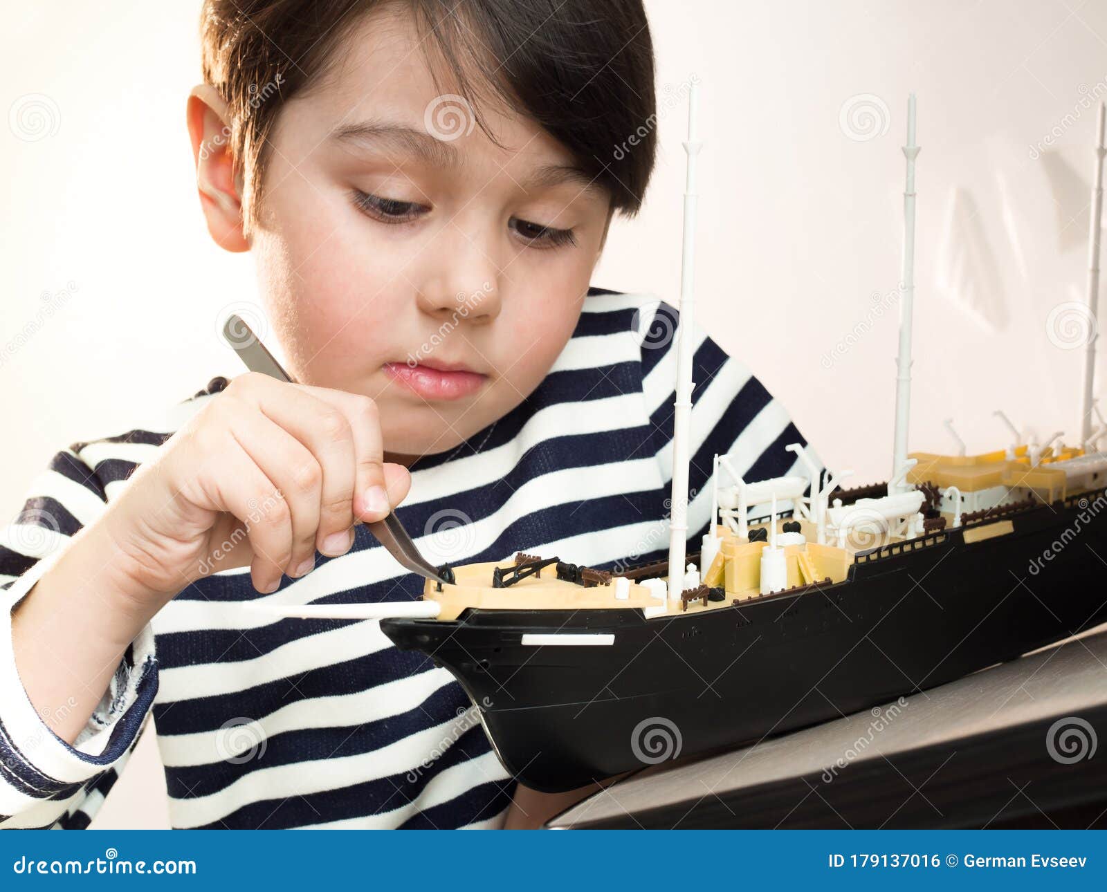 A Small Child Builds a Model Ship Stock Photo - Image of builds ...