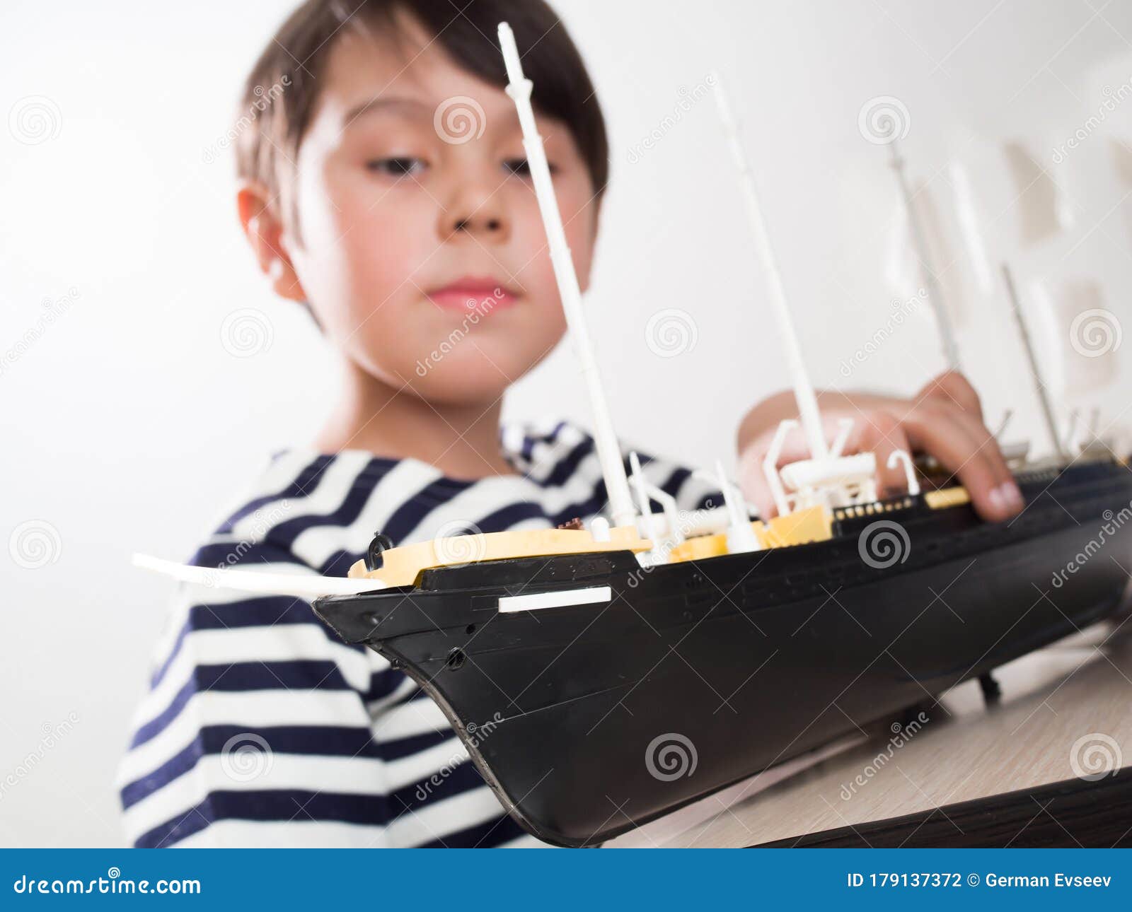 A Small Child Builds a Model Ship Stock Photo - Image of home, model ...