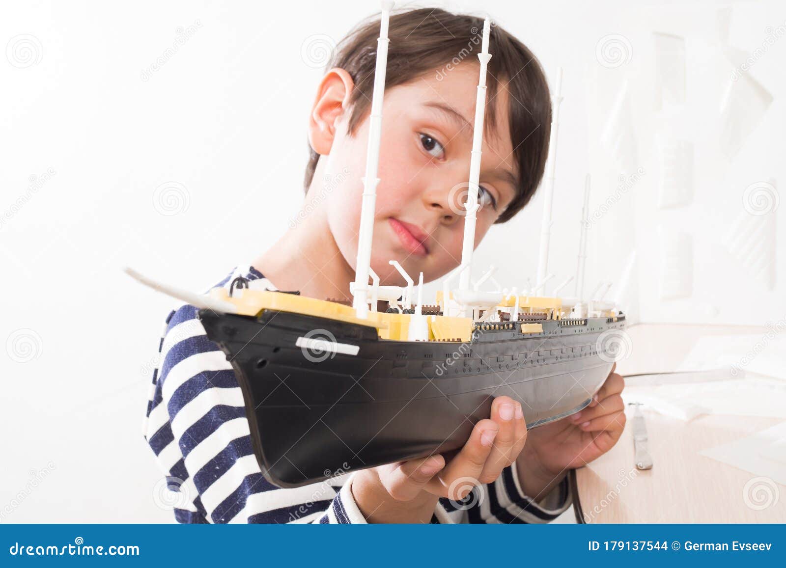 A Small Child Builds a Model Ship Stock Photo - Image of hobby, child ...