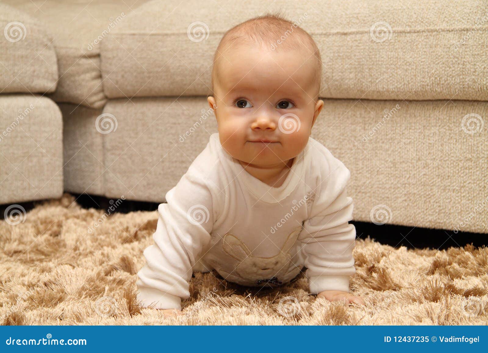 Small child on carpet stock image. Image of clambering - 12437235