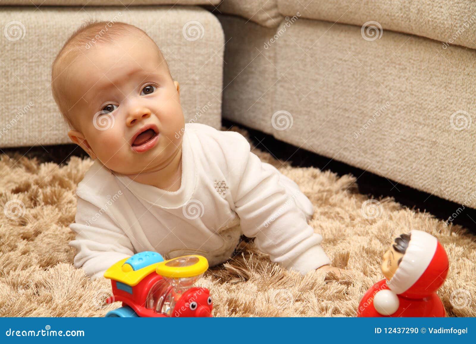 Small child on carpet stock photo. Image of childhood - 12437290