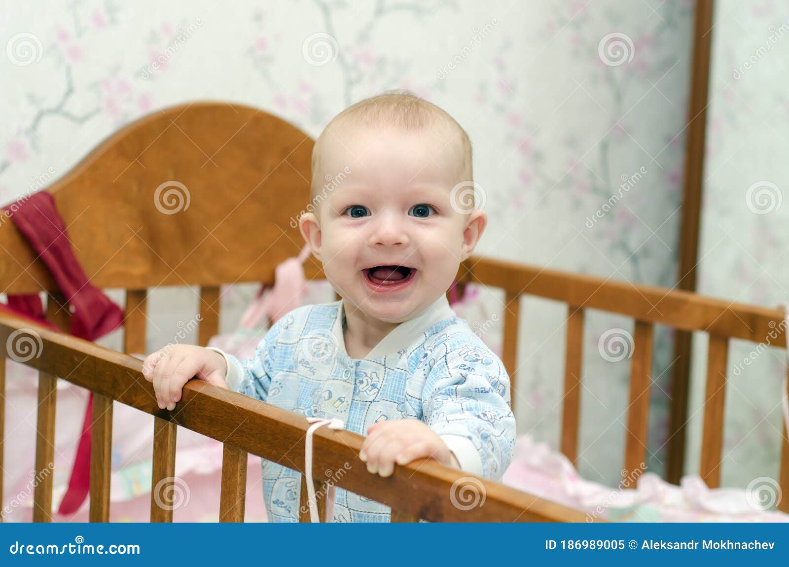 A small child is in a cot stock image. Image of beauty - 186989005