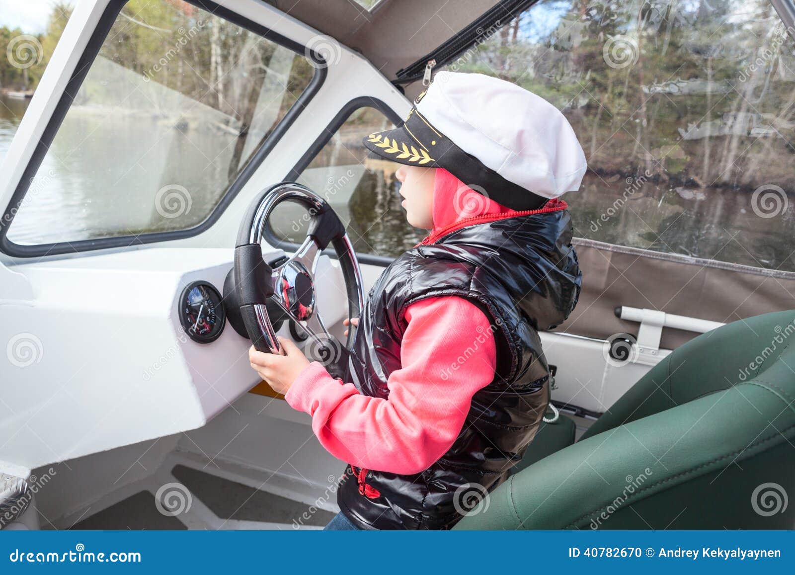 Small Child Driving Motorboat As Captain on Deck Stock Photo - Image of ...