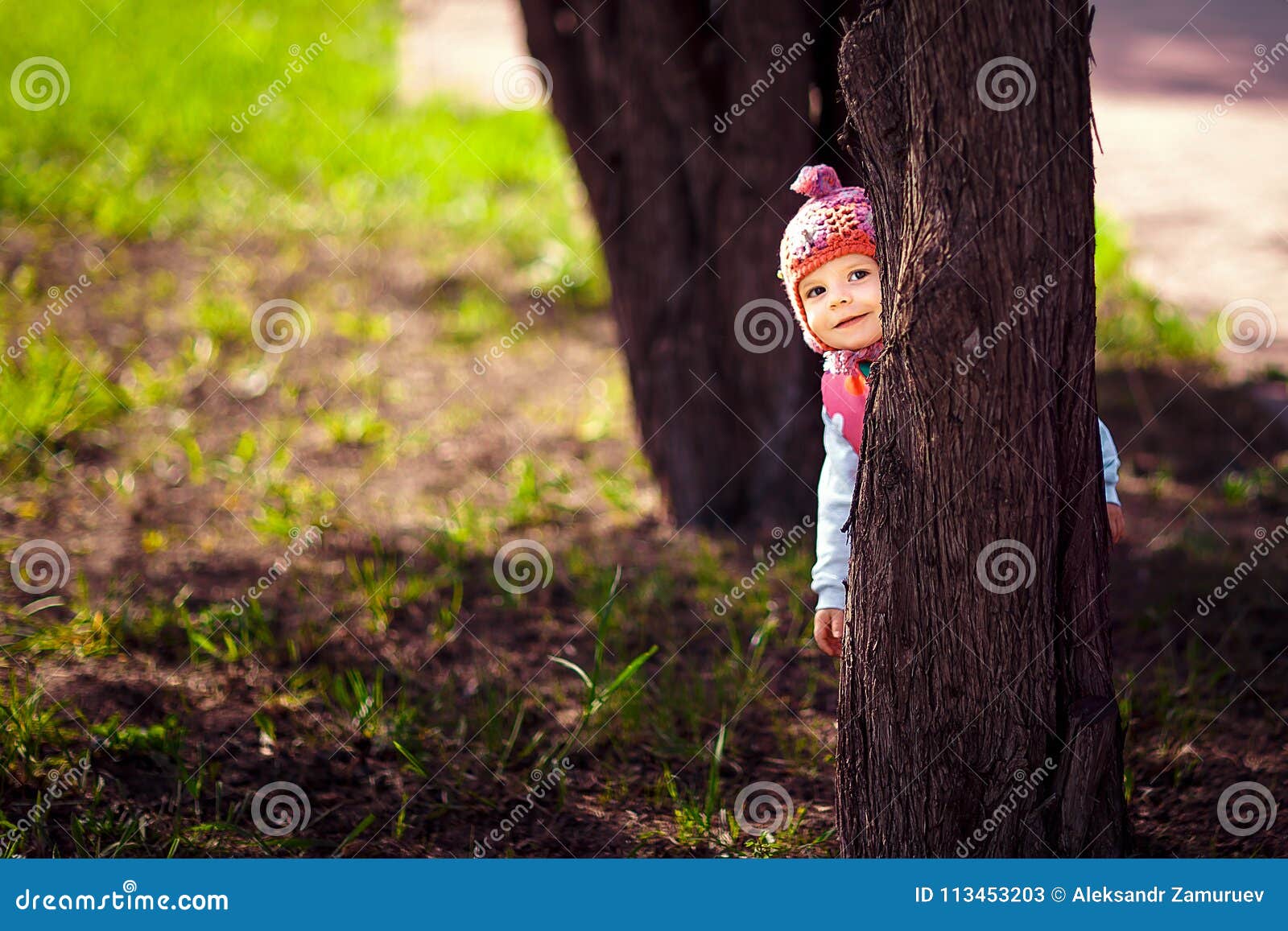 Small Child Hiding Behind a Tree Stock Image - Image of happy, little ...