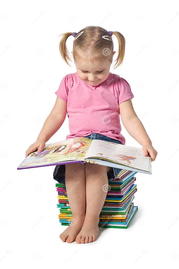 Small child reading a book stock image. Image of looking - 17985557