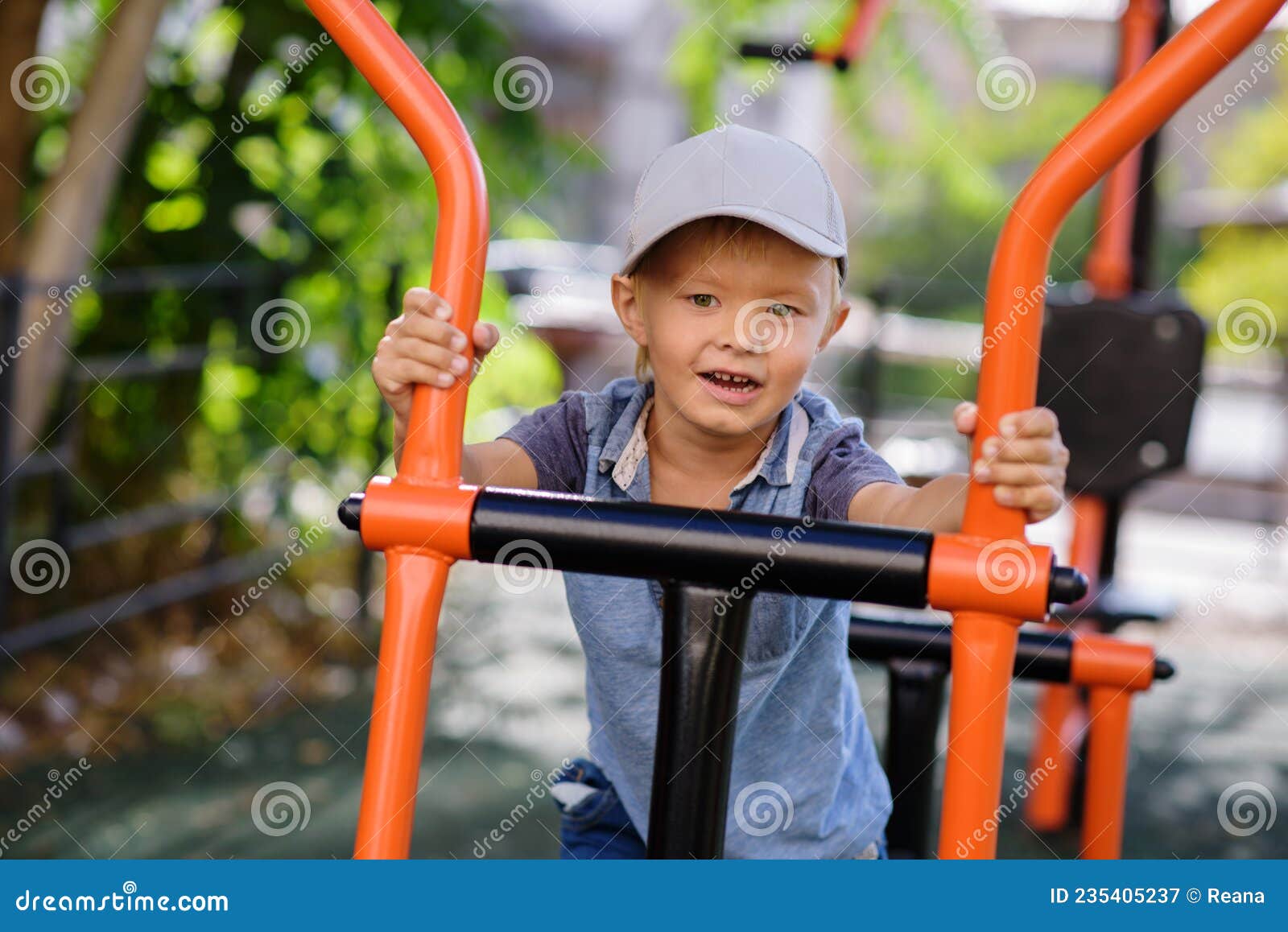 Boy on the playground stock image. Image of cheerful - 235405237