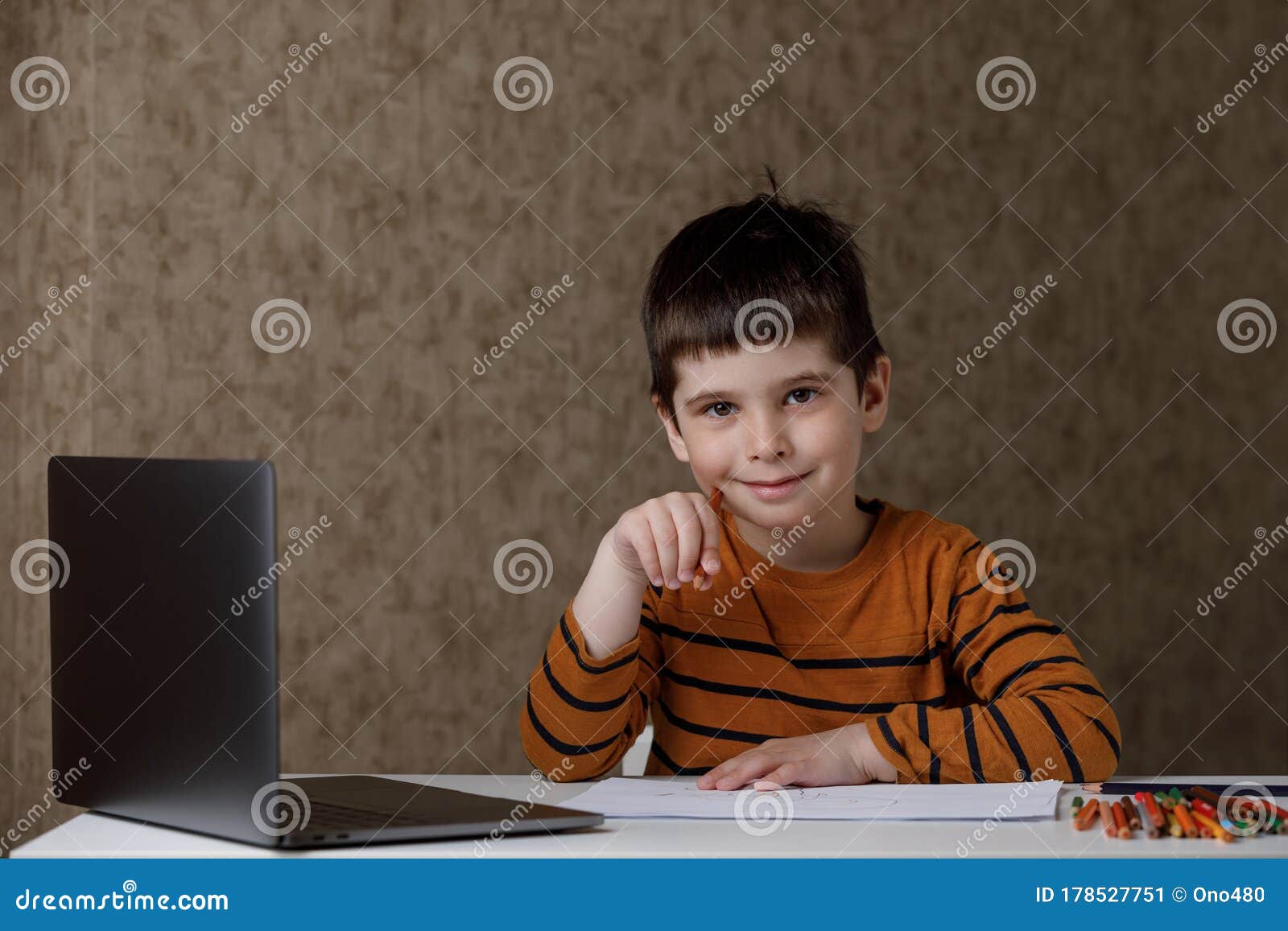 A Small Child is Studying at the Computer. Distance Learning at Home ...