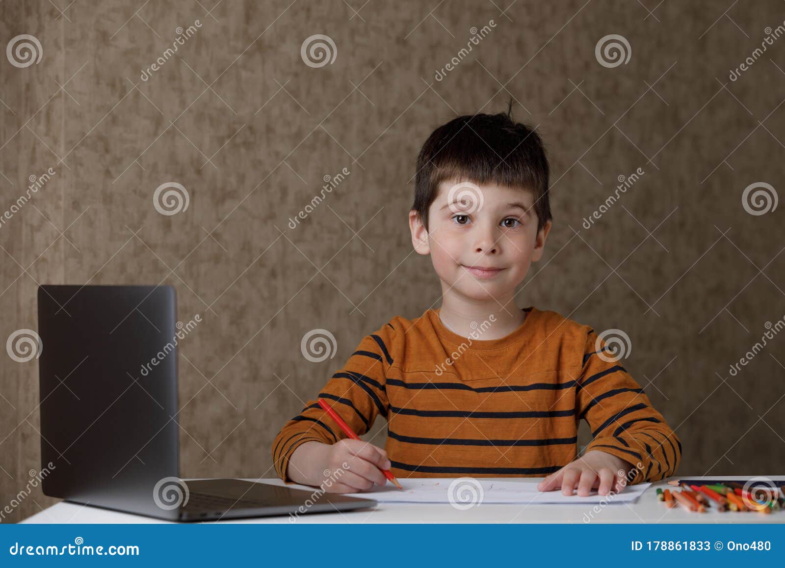 A Small Child is Studying at the Computer. Distance Learning at Home ...