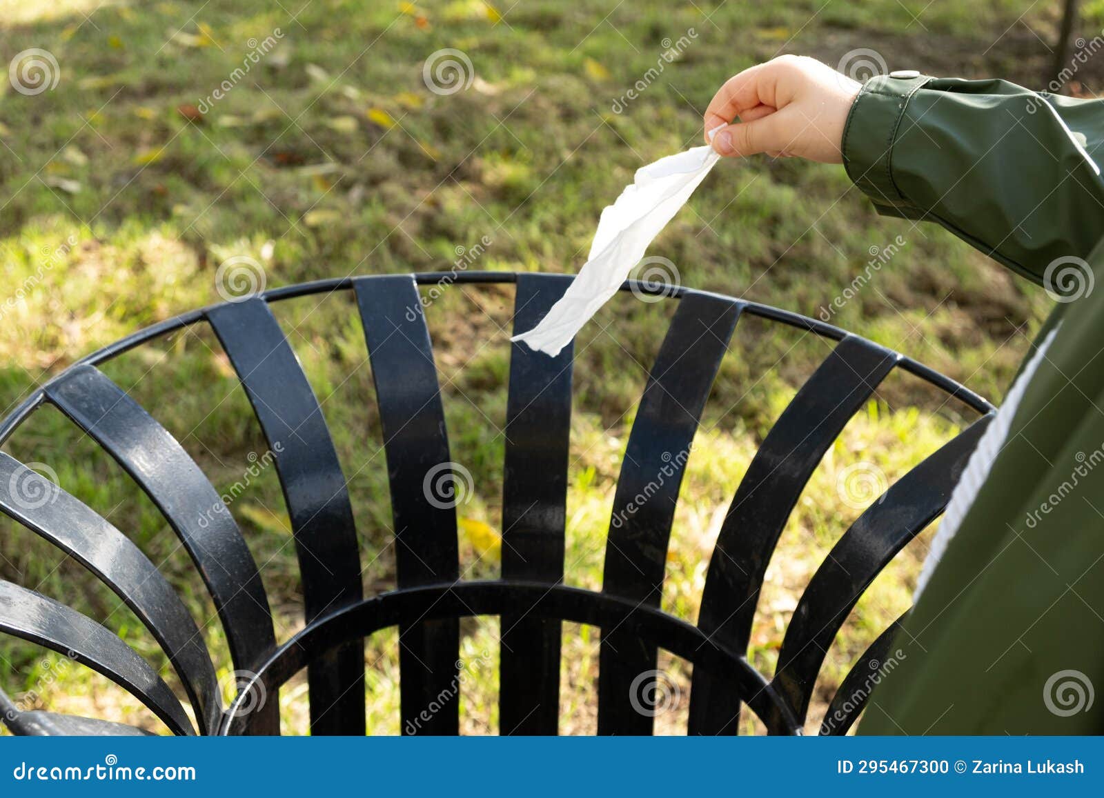 A Small Child Throws Wet Wipe Trash into the Trash Bin. Garbage Sorting ...