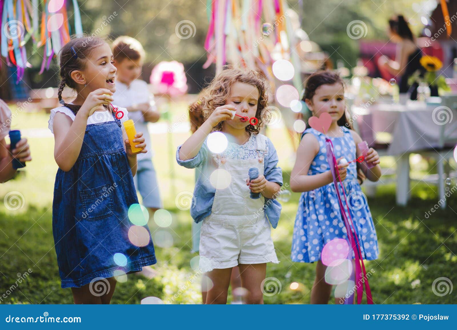 Small Children Outdoors in Garden in Summer, Playing with Bubbles ...