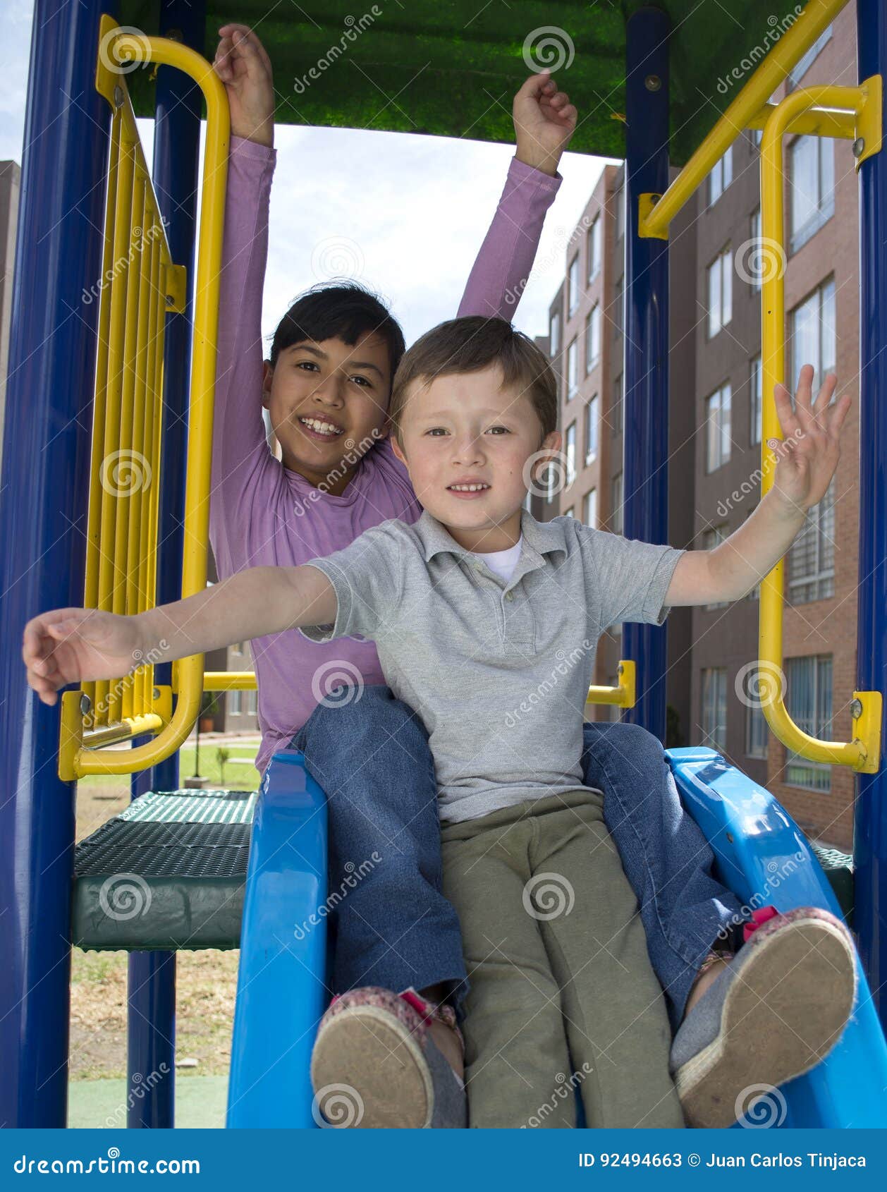 Small childs on slide. stock image. Image of entertainment - 92494663