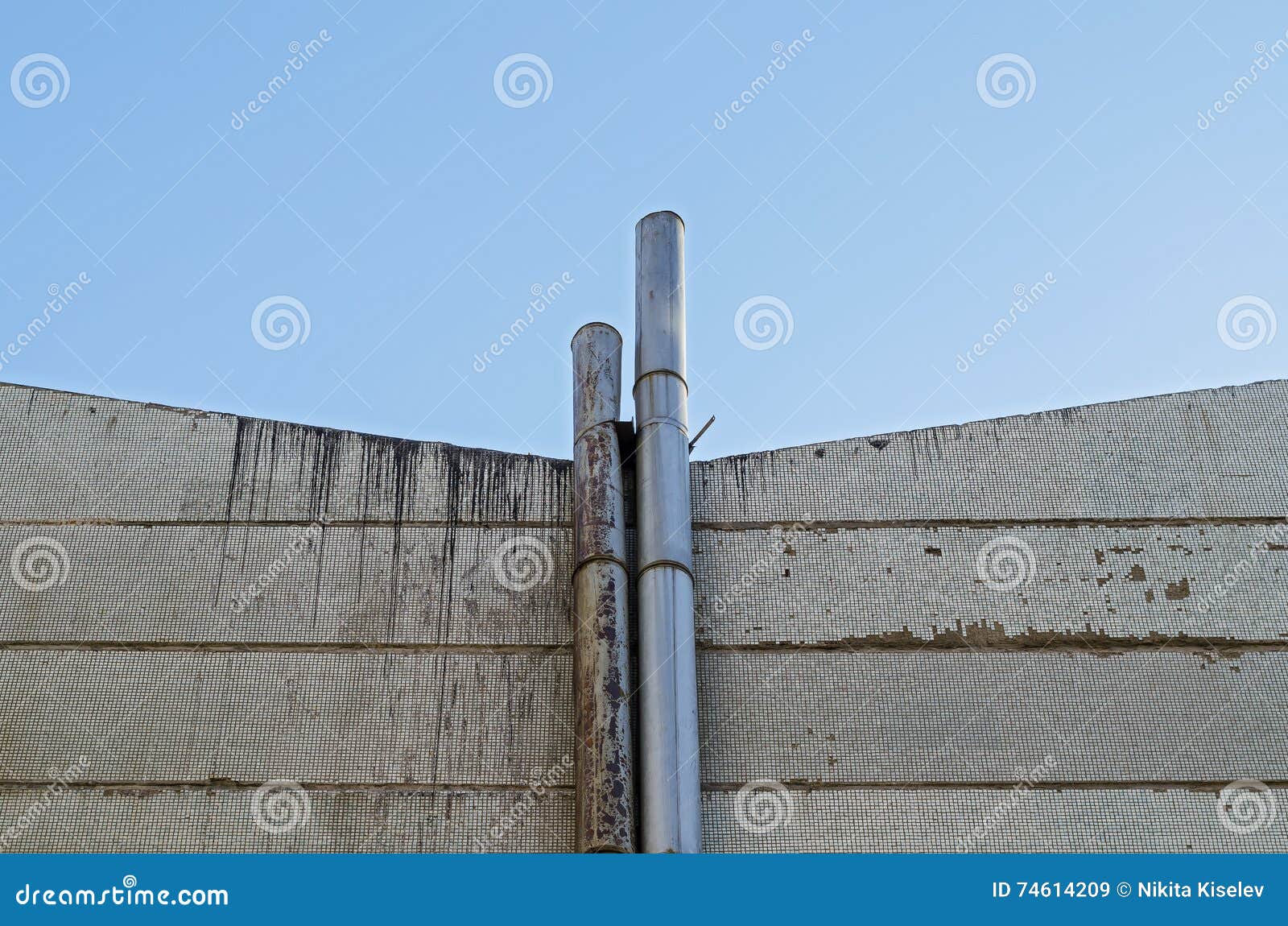 Small Chimneys (smokestack) Pipe on Yellow Wall with Blue Sky Stock ...